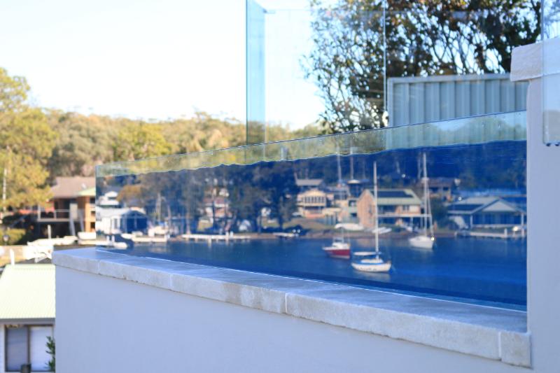 Mastering Challenges: Custom Pool with Luxurious Glass Wall Finish ...